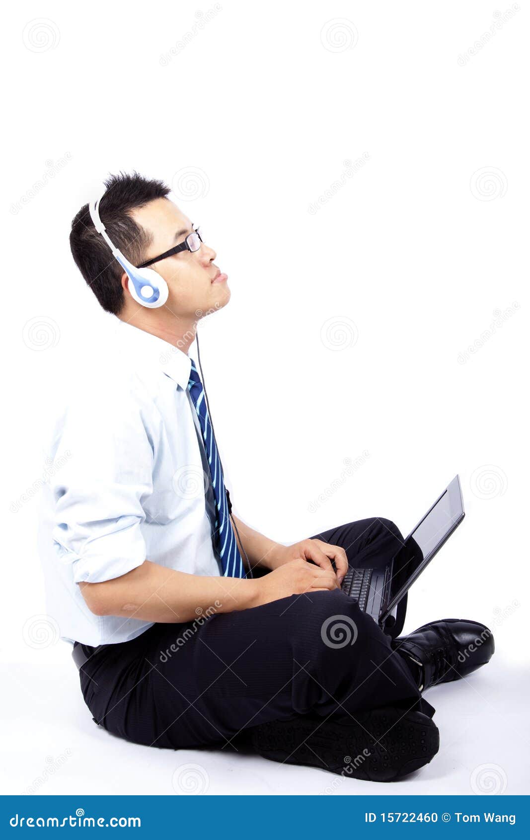 Young Man Sitting and Using a Laptop Stock Photo - Image of computer ...
