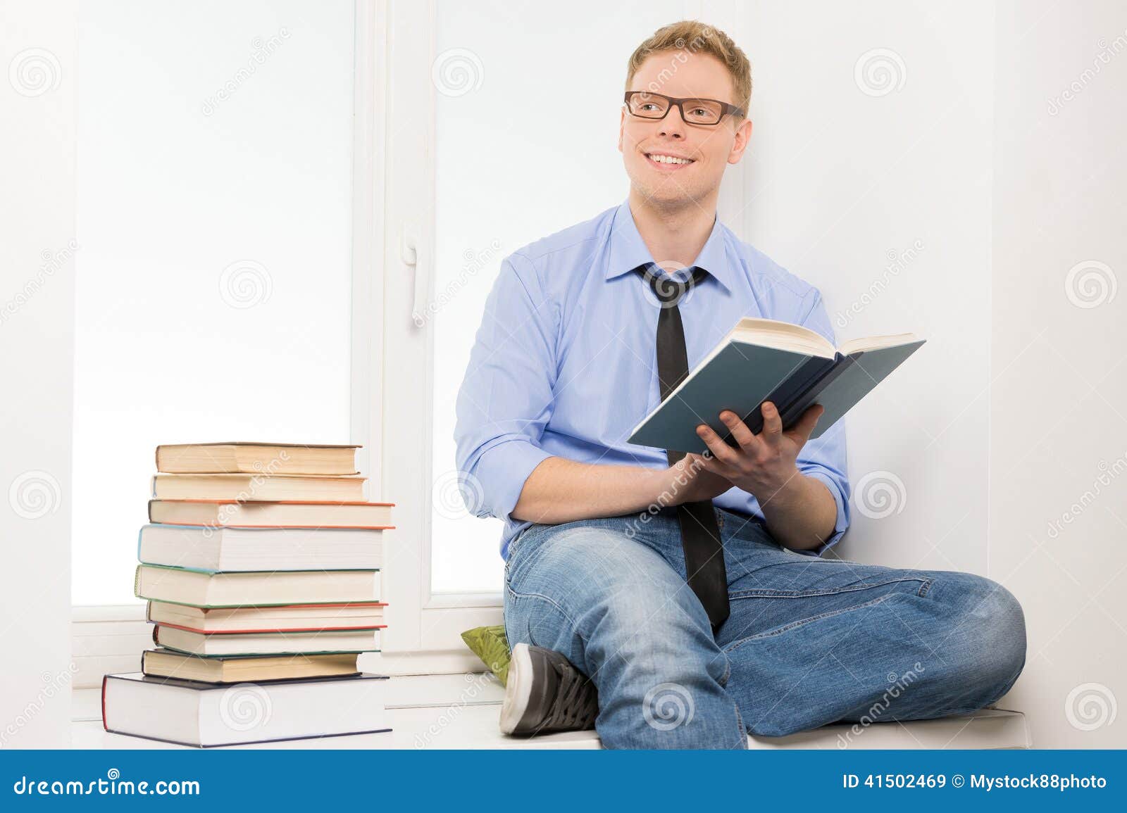 Young Man Sitting on Window Sill. Stock Image - Image of focused ...