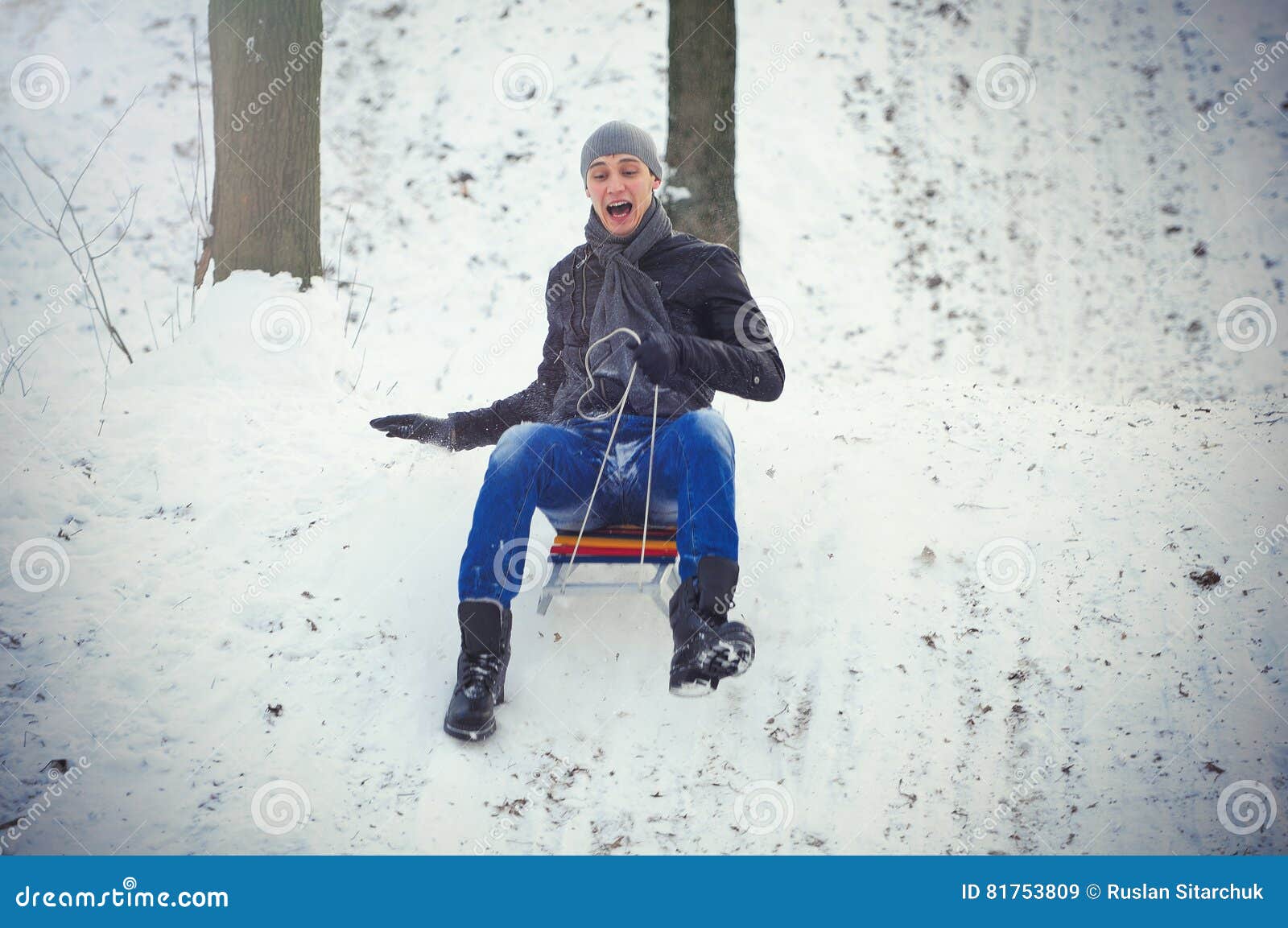 Young man sledding stock image. Image of sled, male, dude - 81753809