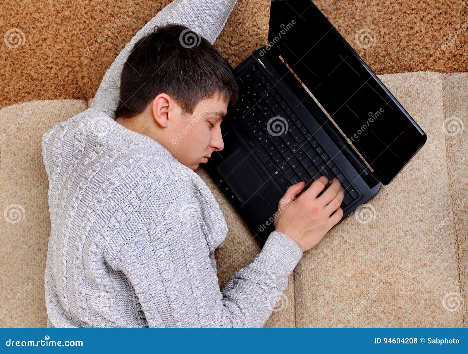 Young Man sleep on Laptop stock photo. Image of sleeping - 94604208
