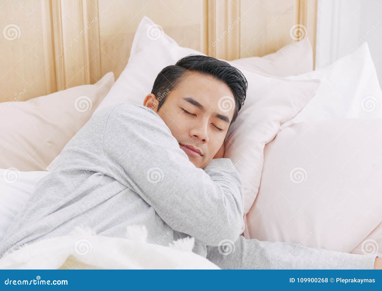 Man sleeping in bed stock photo. Image of lifestyle - 109900268