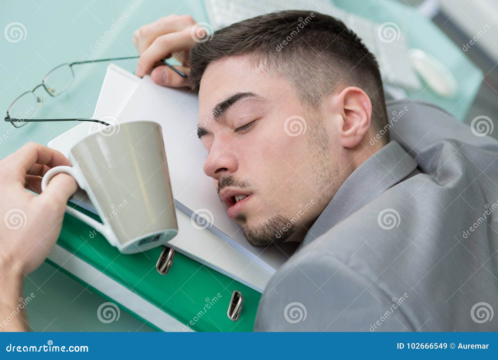 Young man sleeping at desk stock image. Image of insomnia - 102666549