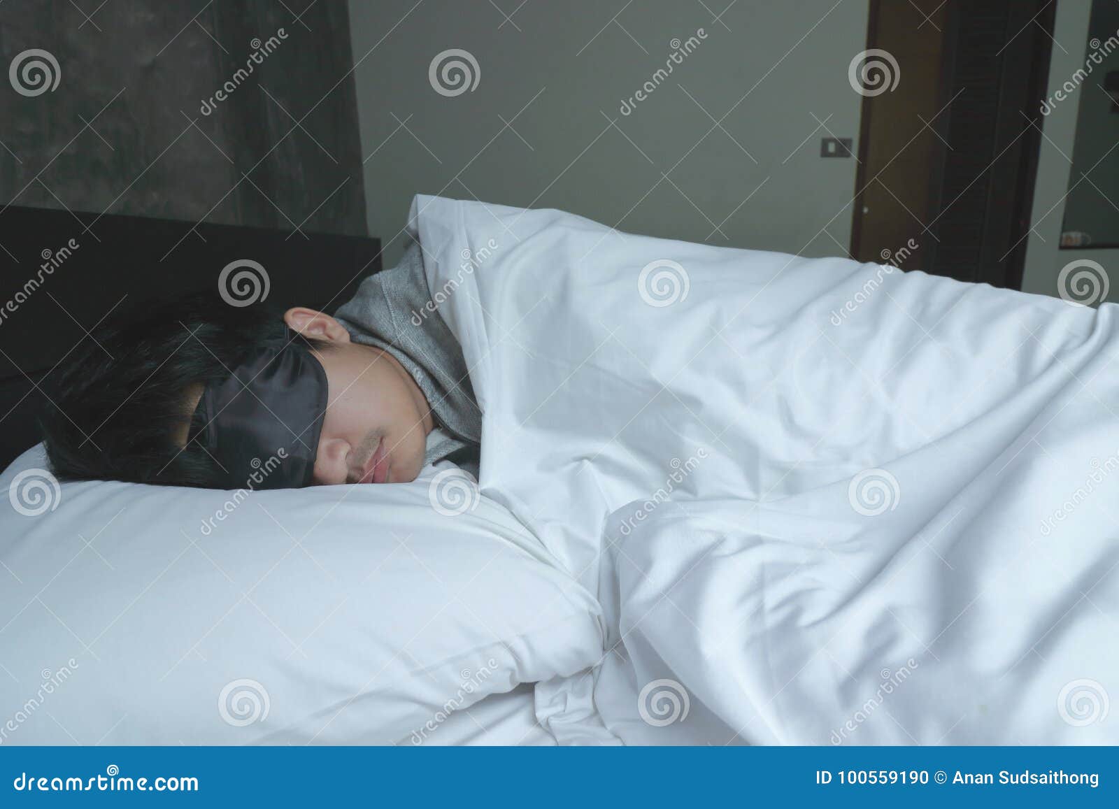 Young Man with Sleeping Mask Sleep on the Bed Stock Photo - Image of ...