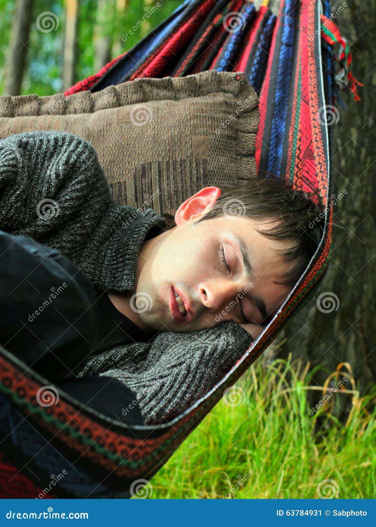 Young Man sleeping outdoor stock image. Image of hammock - 63784931