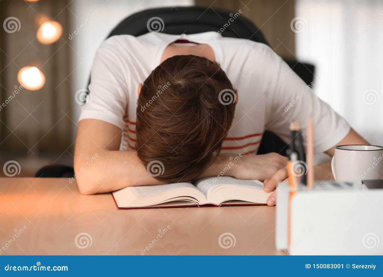 Young Man Sleeping while Sitting at Table with Book Stock Image - Image ...