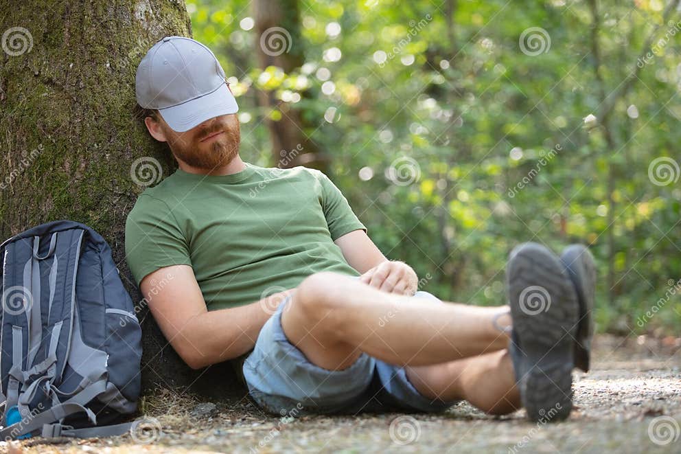 Young Man Sleeping Under Tree Stock Photo - Image of asleep, freetime ...