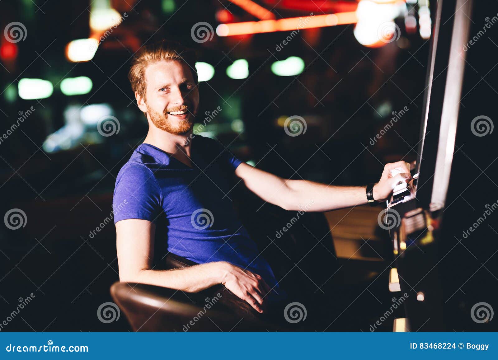 Young Man with Slot Machine in the Casino Stock Photo - Image of chance ...