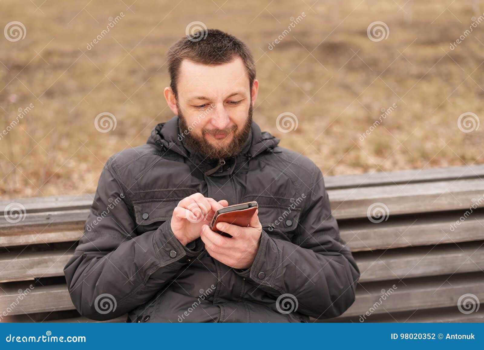 Young Man with a Smartphone Outdoors Stock Photo - Image of ...