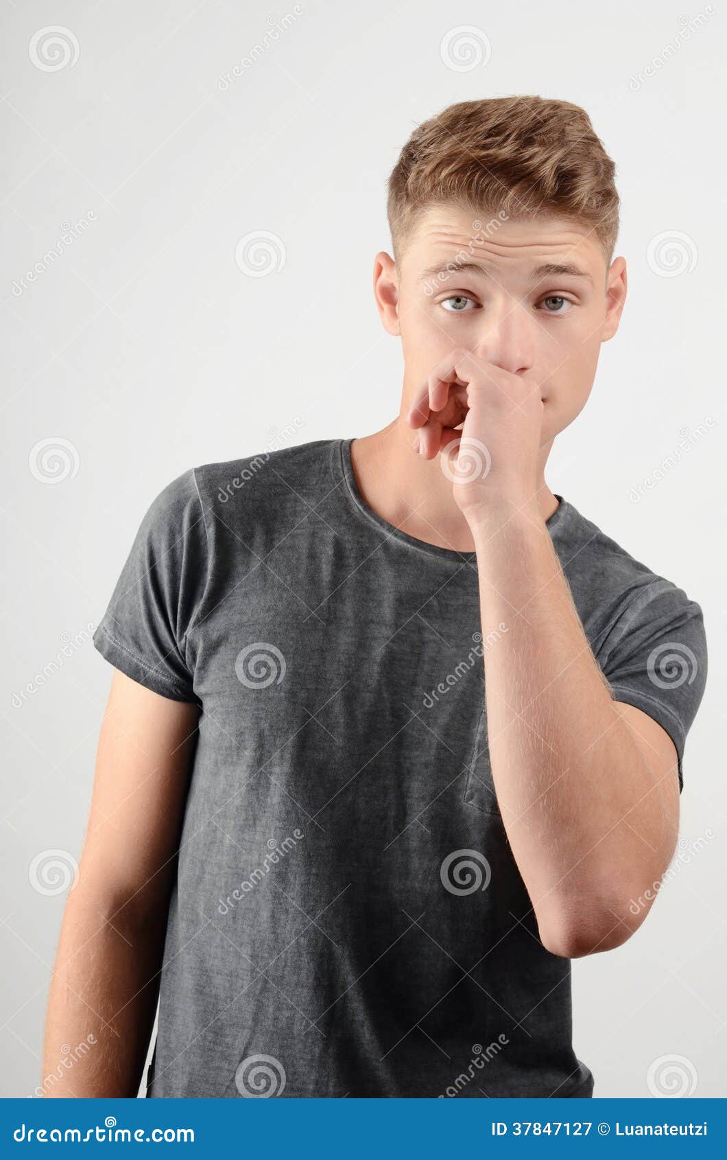 Young Man Smelling Something Bad. Disgusting Odor. Stock Image - Image ...