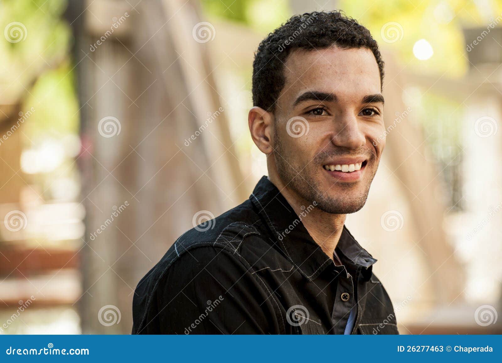 Young man smiling stock image. Image of light, background - 26277463