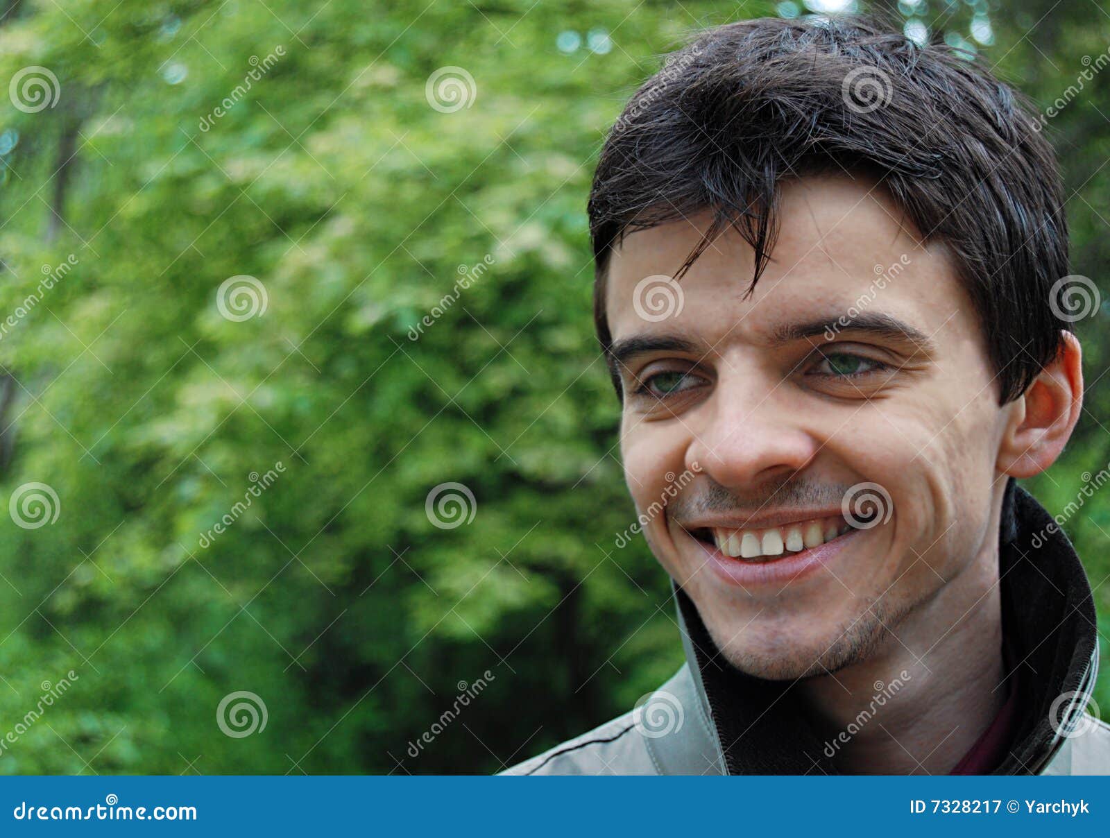 Young man smiling stock image. Image of male, bushes, emotion - 7328217