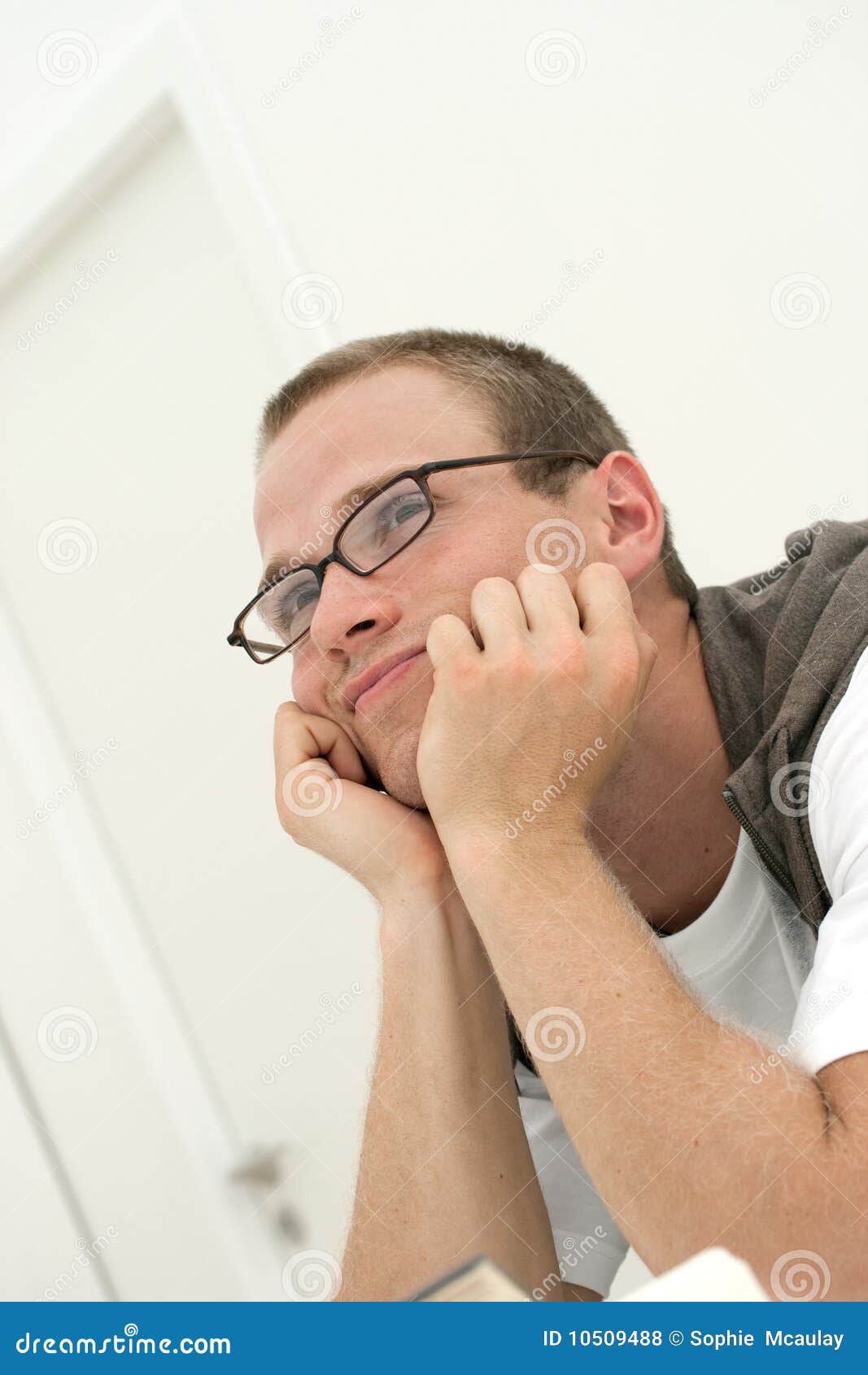 Young Man Smiling and Daydreaming Stock Photo - Image of caucasian ...
