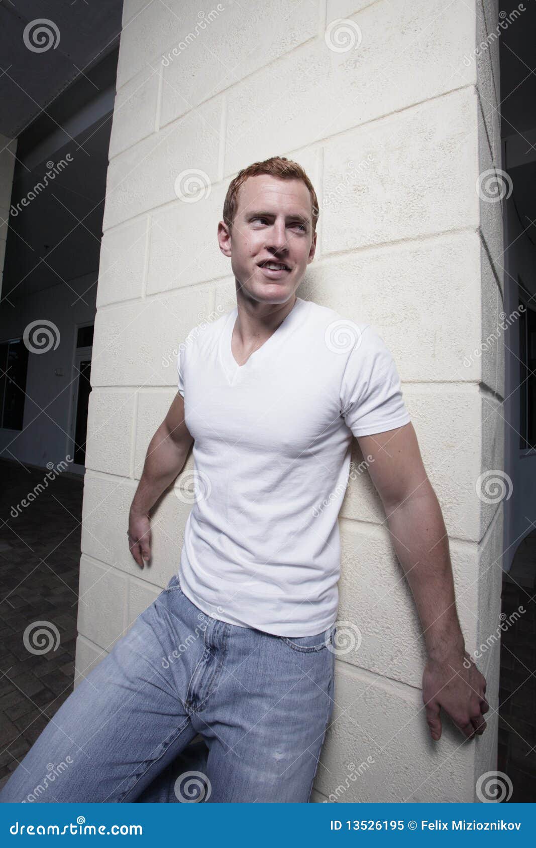 Young Man Smiling and Glancing Stock Image - Image of white, happy ...