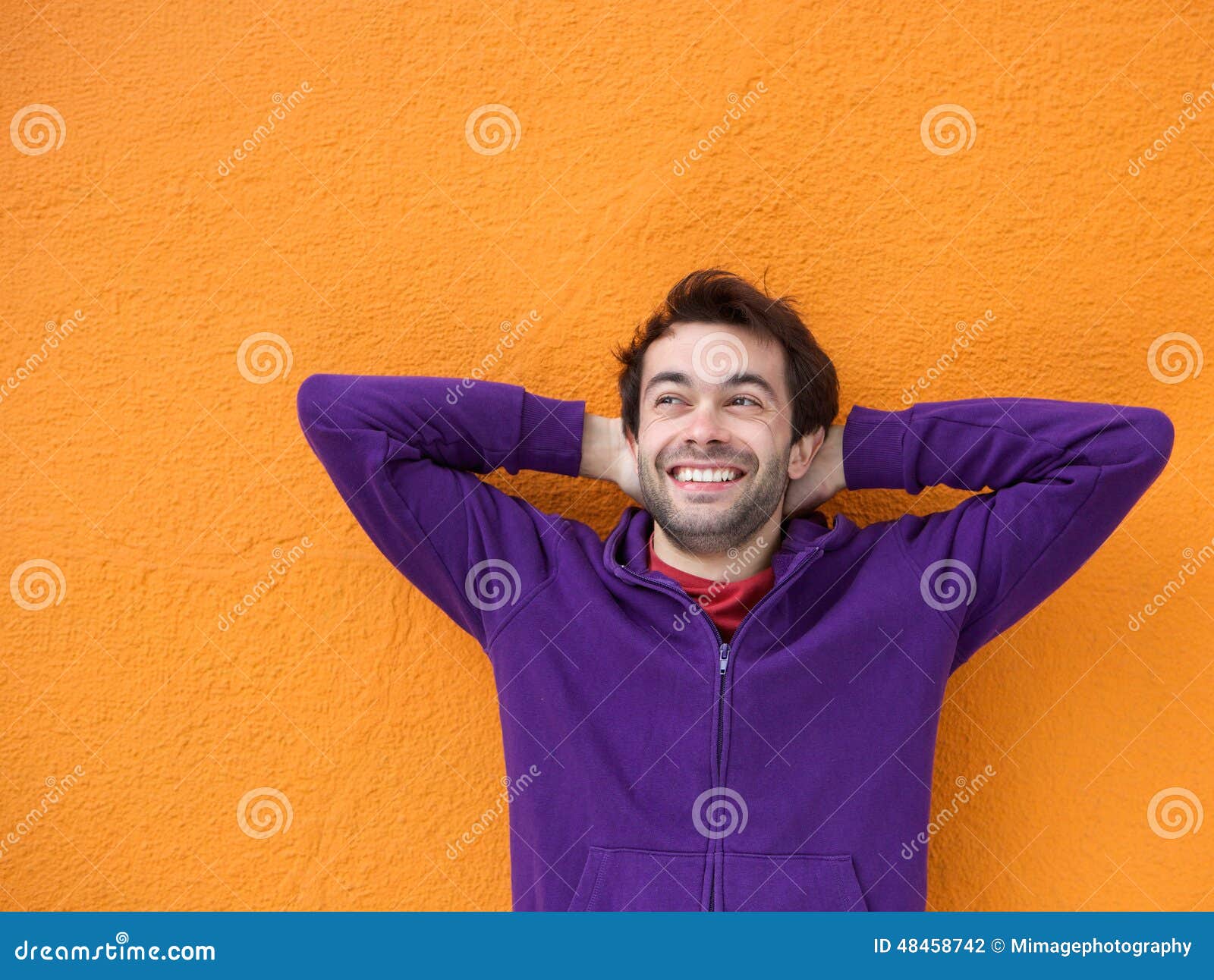 Young Man Smiling with Hands Behind Head Stock Photo - Image of beard ...