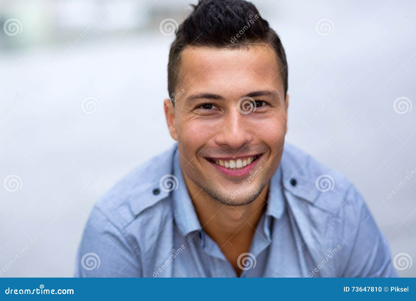 Young man smiling stock photo. Image of satisfaction - 73647810
