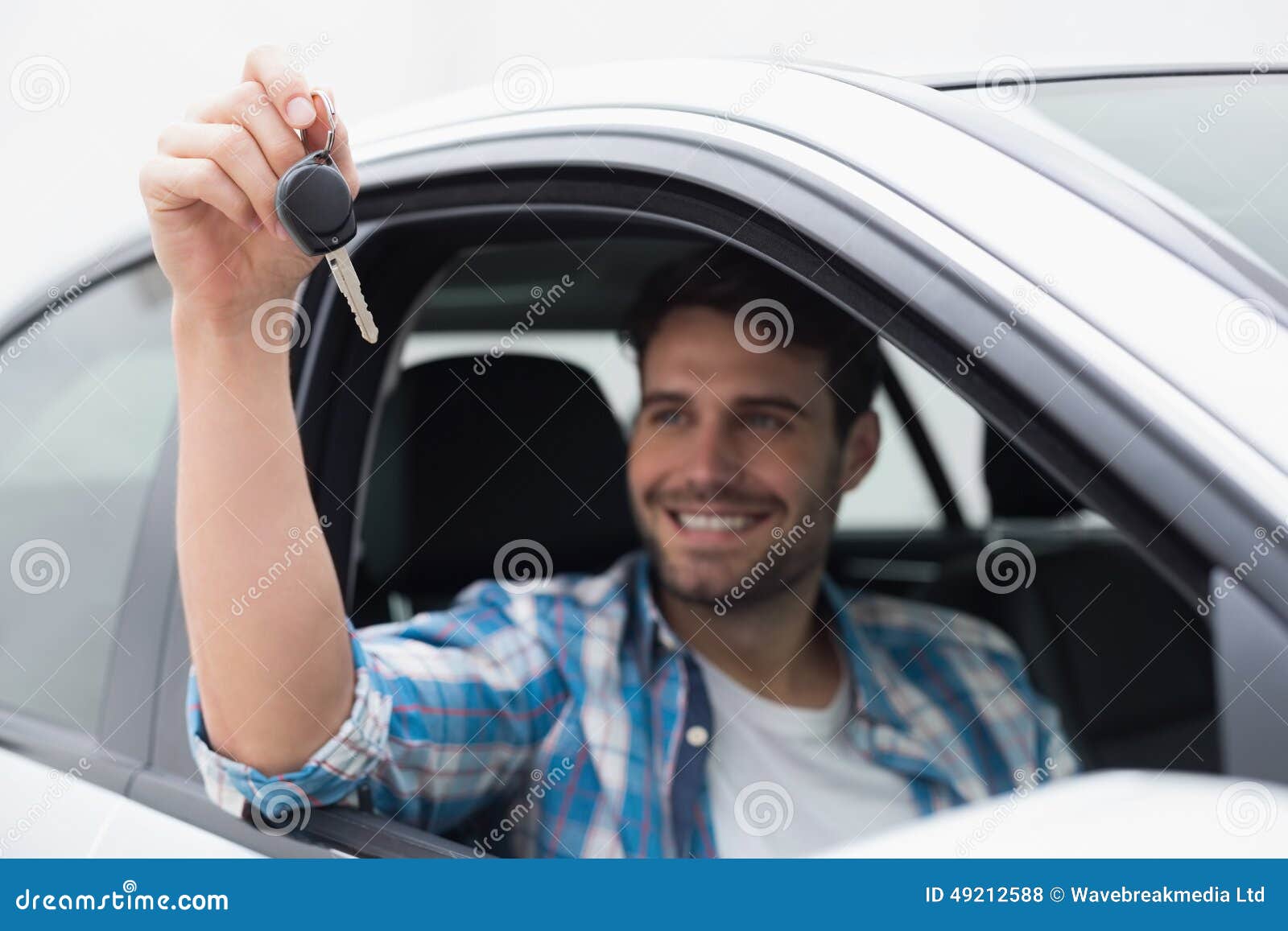 Young Man Smiling and Holding Key Stock Photo - Image of shoulders ...