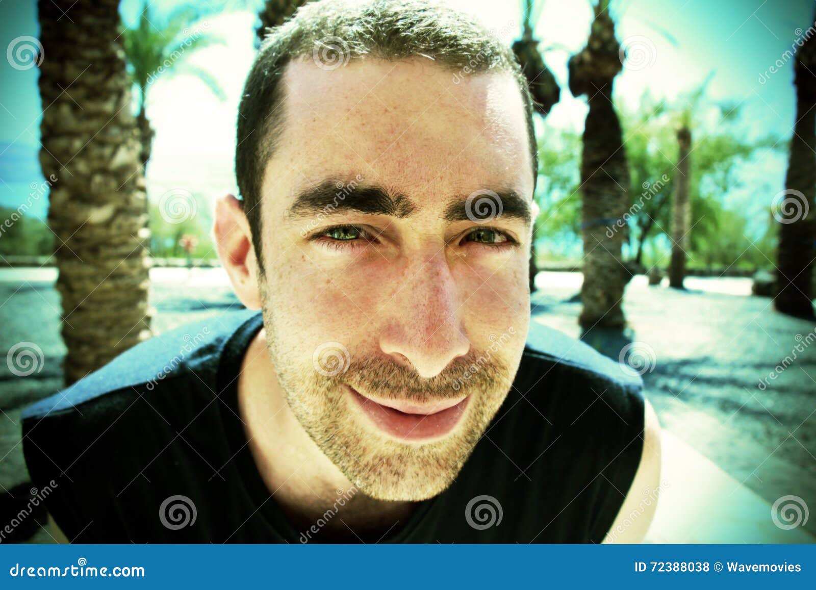 Young Man Smiling and Looking at Camera Stock Photo - Image of happy ...