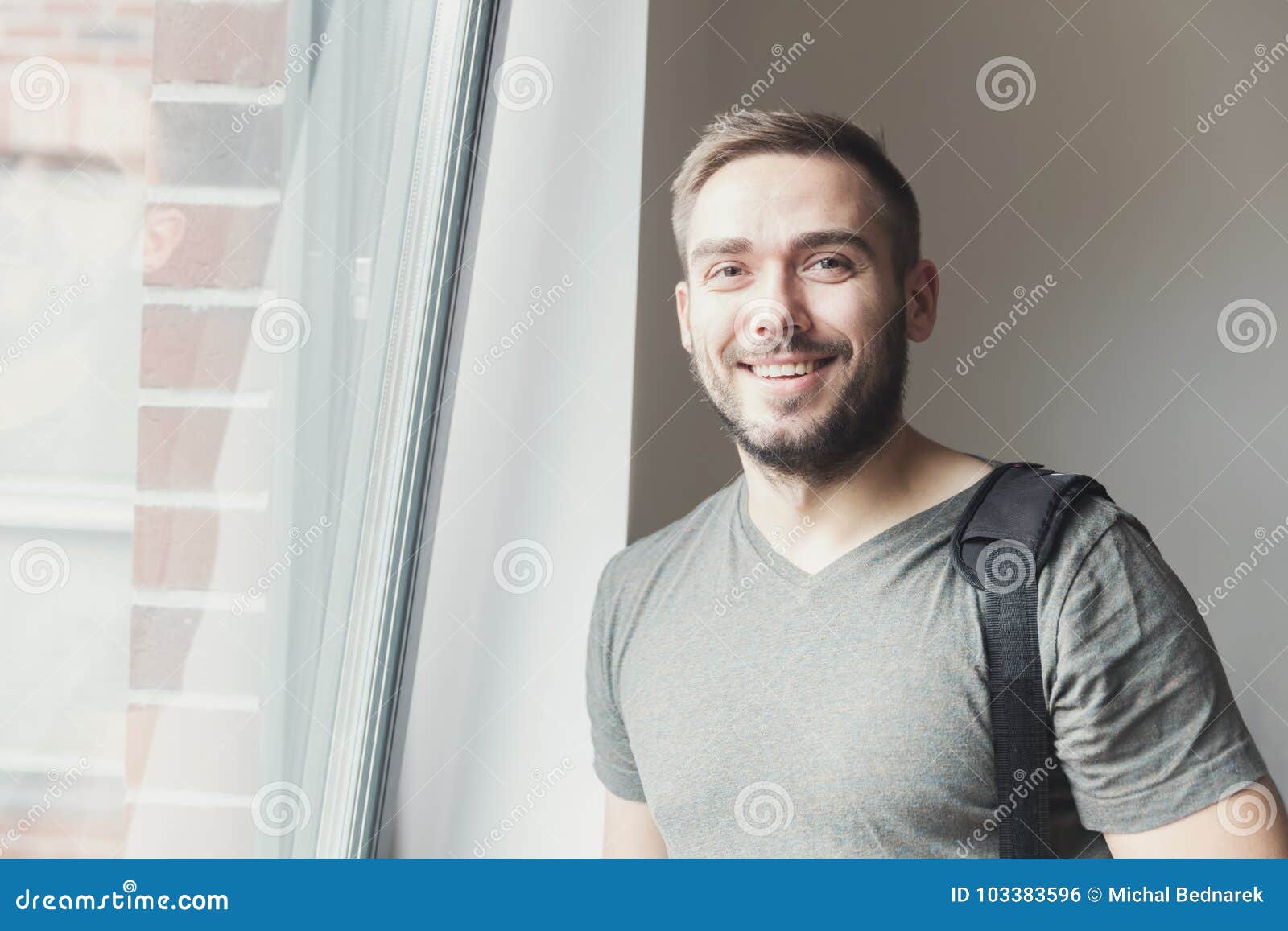 Young Man Smiling Next To the Window. Stock Photo - Image of enjoy ...