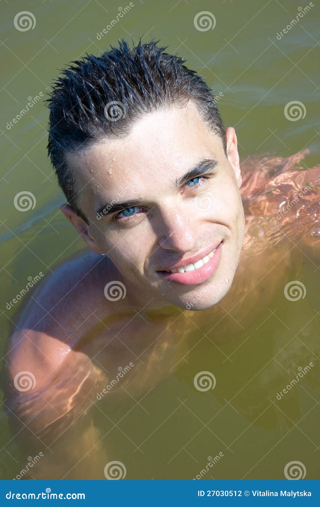 Young Man Smiling in the Water Stock Photo - Image of peaceful, serene ...