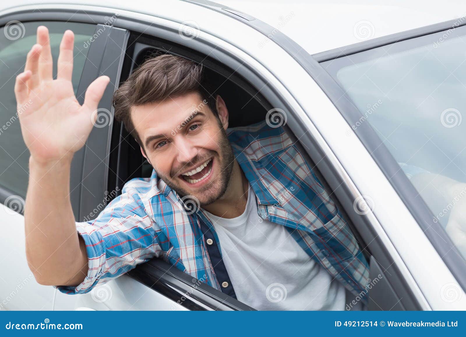 Young Man Smiling and Waving Stock Photo - Image of leisure ...