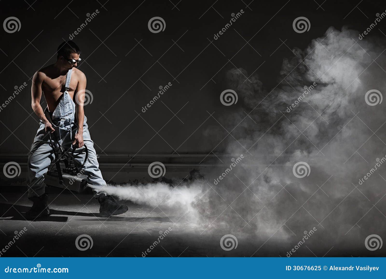 Young Man with a Smoke Machine Stock Image - Image of overalls, effect ...