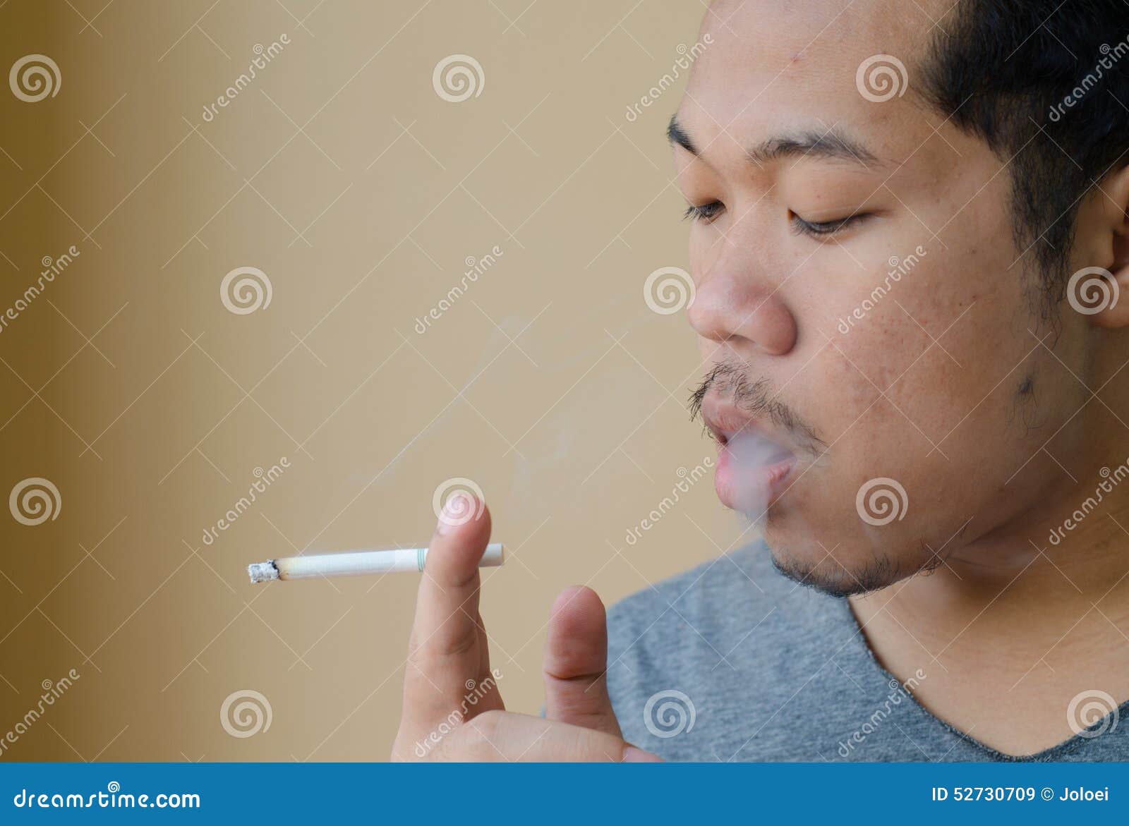 Young man smoking stock image. Image of face, close, adult - 52730709