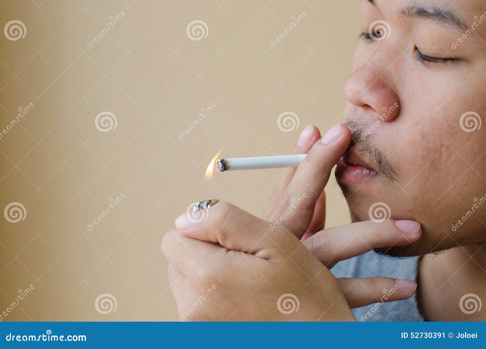 Young Man Smoking a Cigarette Stock Image - Image of thailand, person ...
