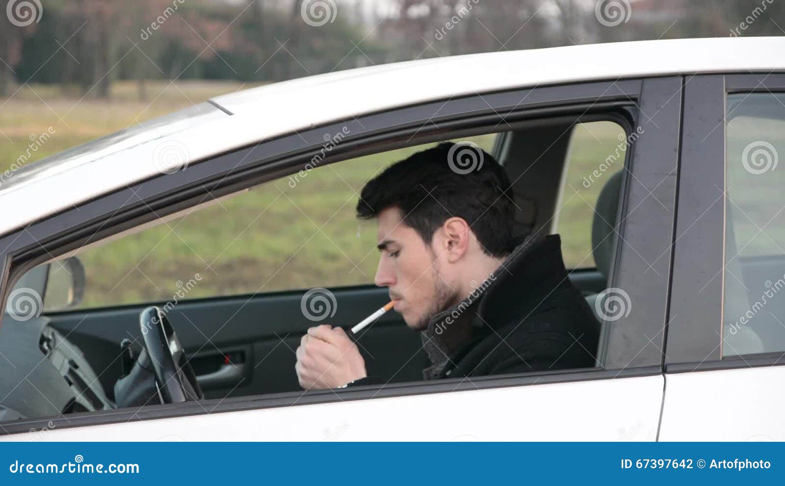 Young Man Smoking Cigarette while Driving Stock Footage - Video of ...