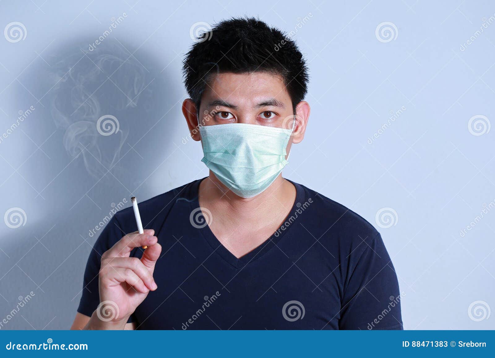 Young Man Smoking Cigarette with Protective Mask Stock Image - Image of ...