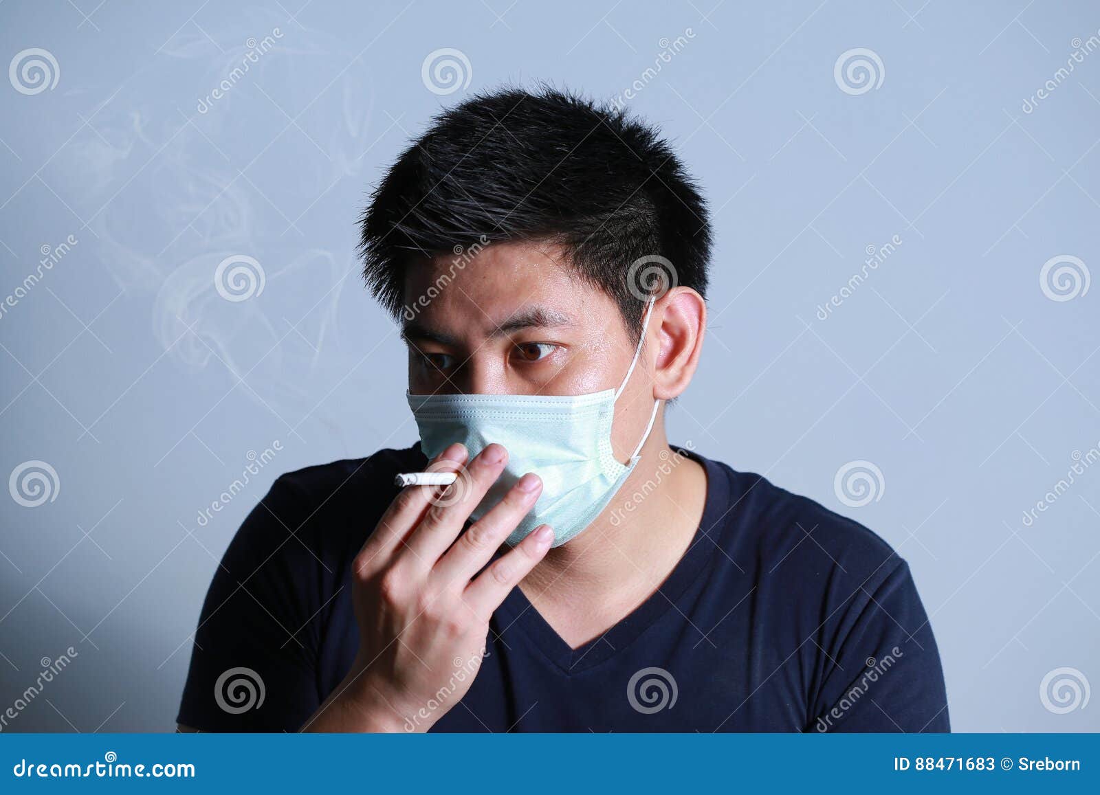 Young Man Smoking Cigarette with Protective Mask Stock Image - Image of ...