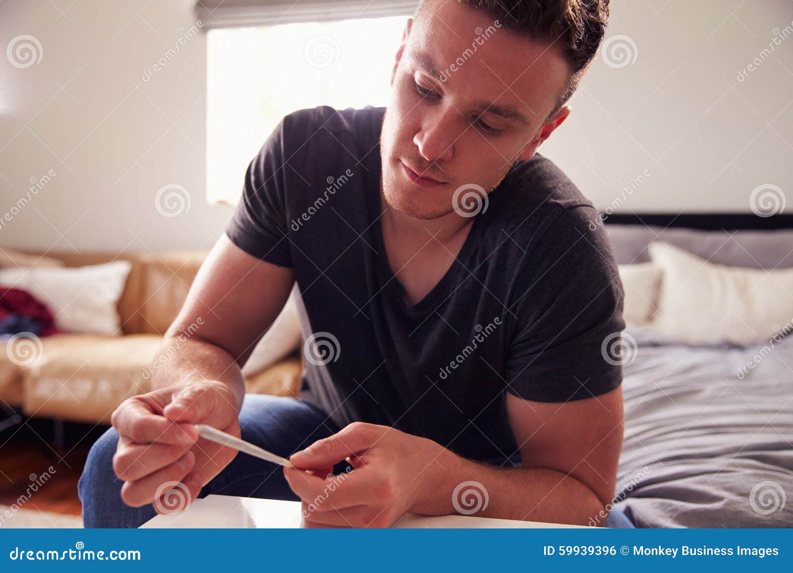 Young Man Smoking Marijuana at Home Stock Photo - Image of social ...