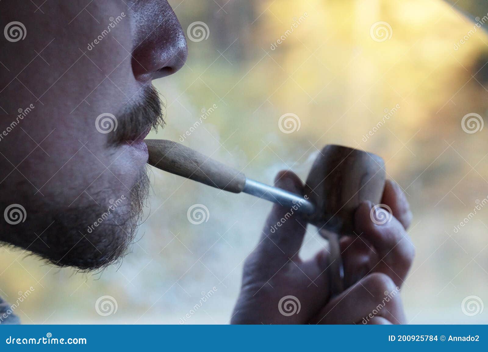 Young Man Smoking a Pipe, Side View Stock Photo - Image of attractive ...