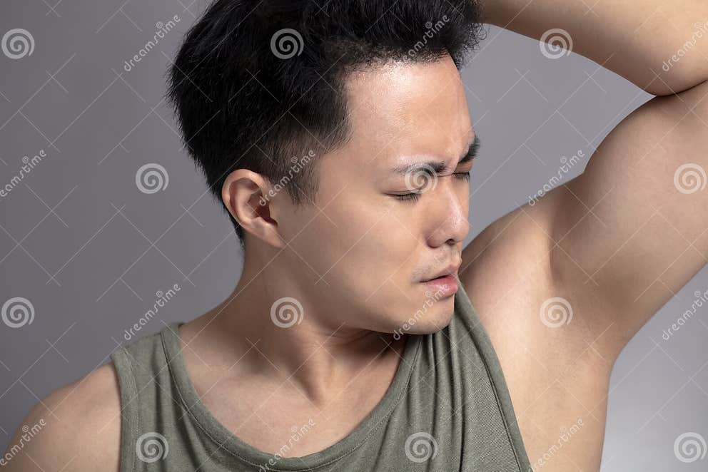 Young Man Sniffing His Armpit Stock Photo - Image of sniff, athlete ...