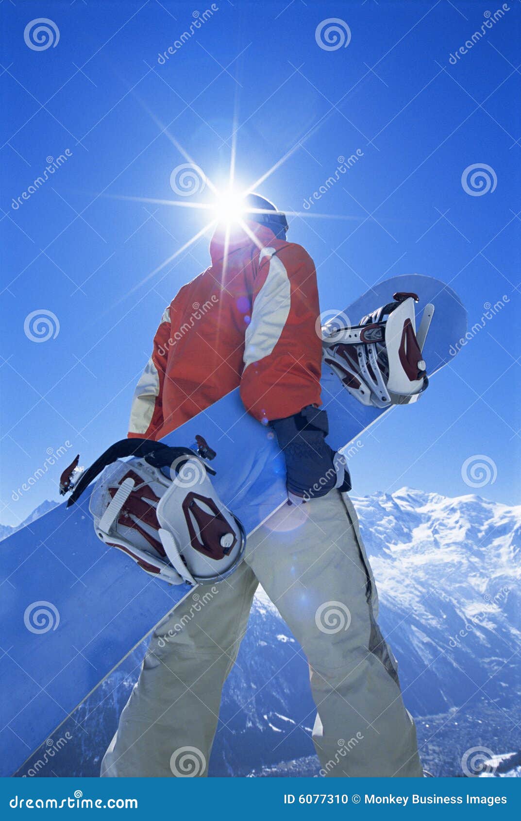 Young man with snowboard stock photo. Image of mountain - 6077310