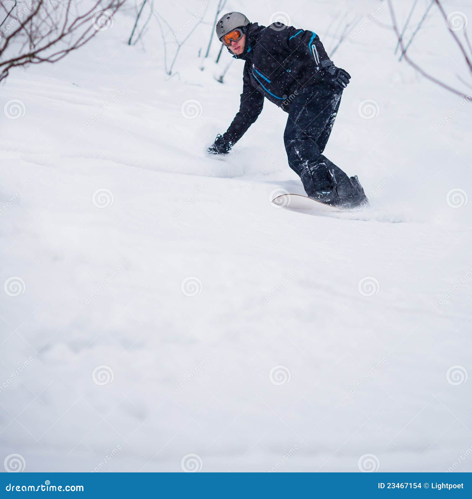 Young Man Snowboarding Down a Slope Stock Photo - Image of skiing, blue ...