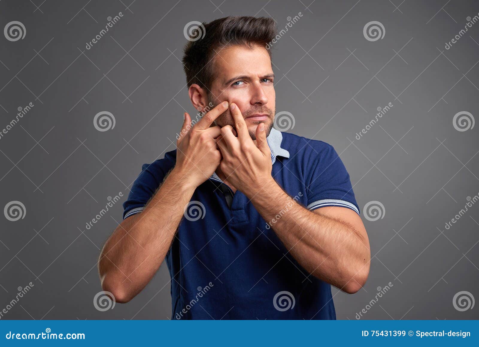 Young man with a spot stock image. Image of indoors, picking - 75431399