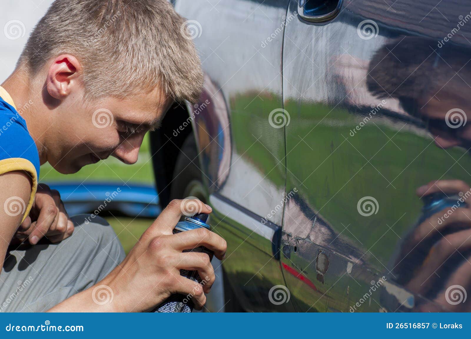 Young man spraying a car. stock image. Image of crash - 26516857