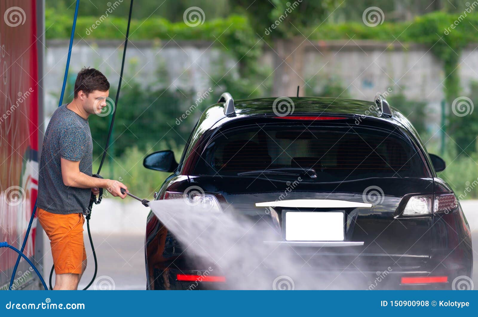 Young Man Spraying of His Car Stock Photo - Image of squirting ...