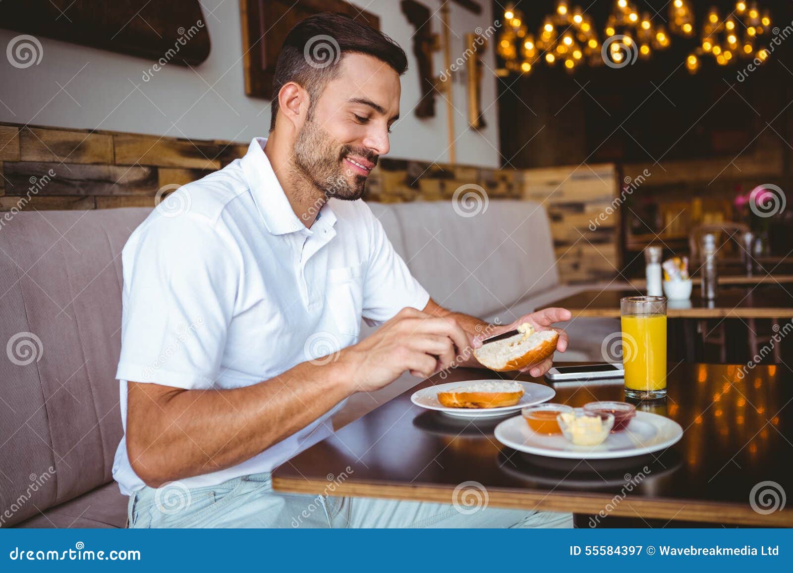 Young Man Spreading Butter on a Toast Stock Image - Image of making ...