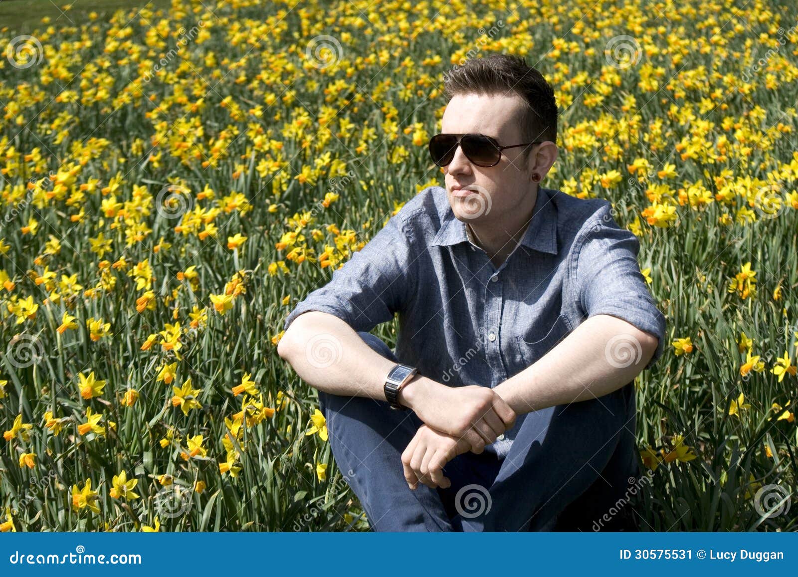 Young Man in Spring Scene with Daffodils Stock Image - Image of adult ...