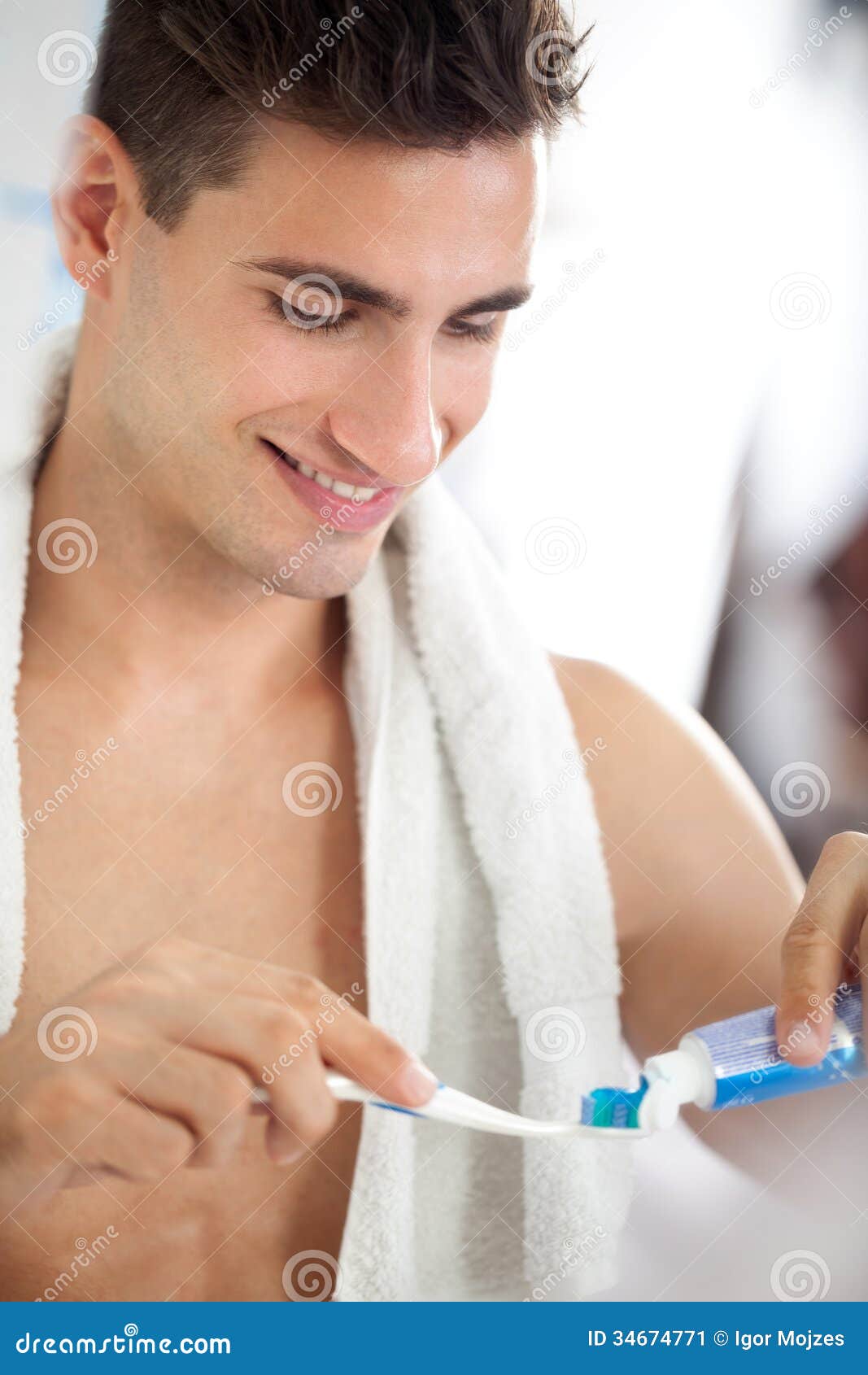 Young Man Squeezes Toothpaste on the Brush Stock Image - Image of ...