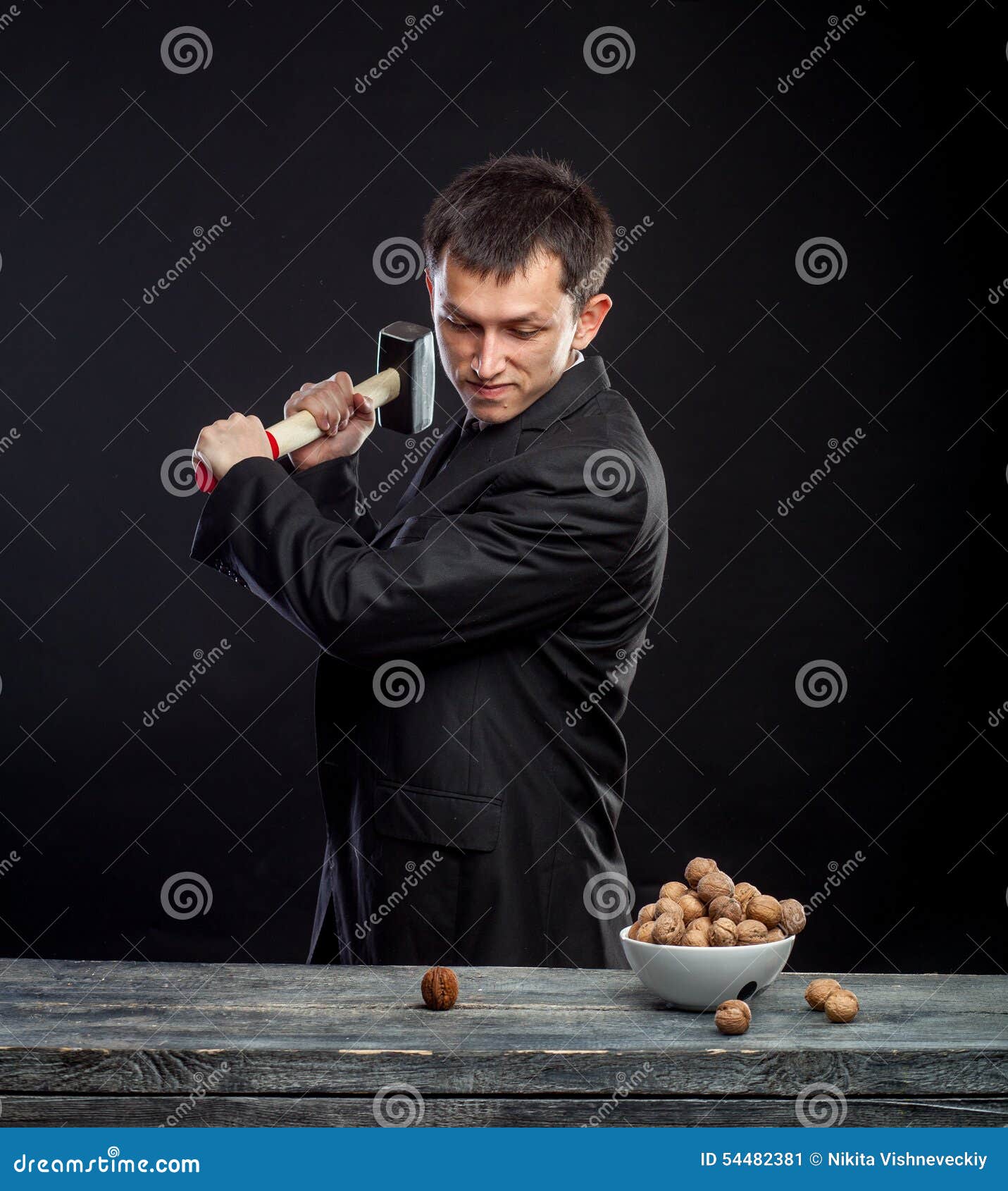 Young man stabs a nut stock image. Image of frustration - 54482381