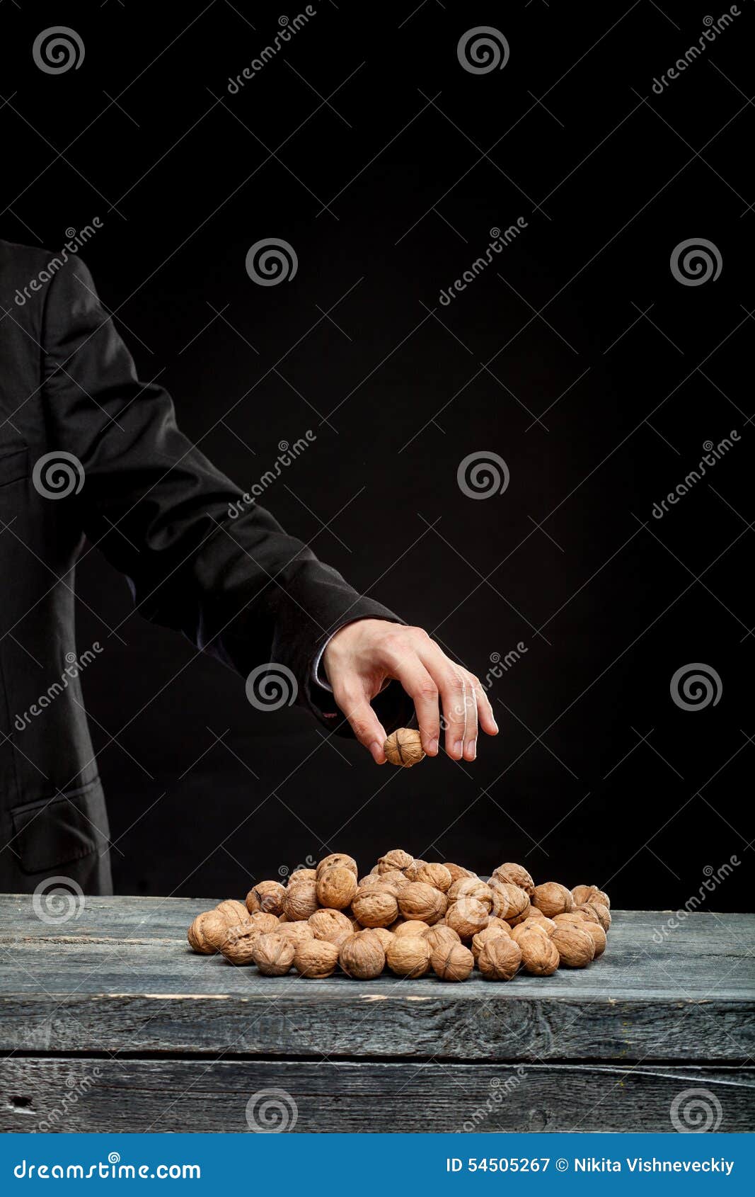 Young man stabs a nut stock image. Image of hill, business - 54505267