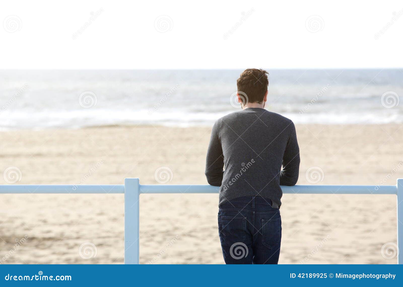 Young man standing alone stock image. Image of jeans - 42189925
