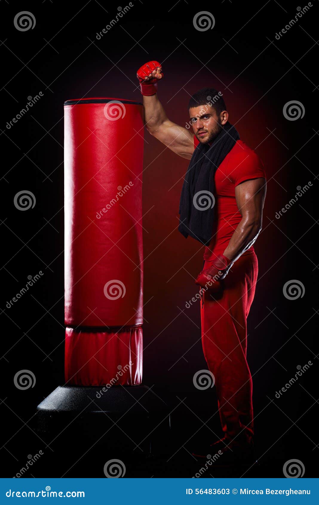 Young Man Standing by Boxing Bag Stock Image - Image of confident ...