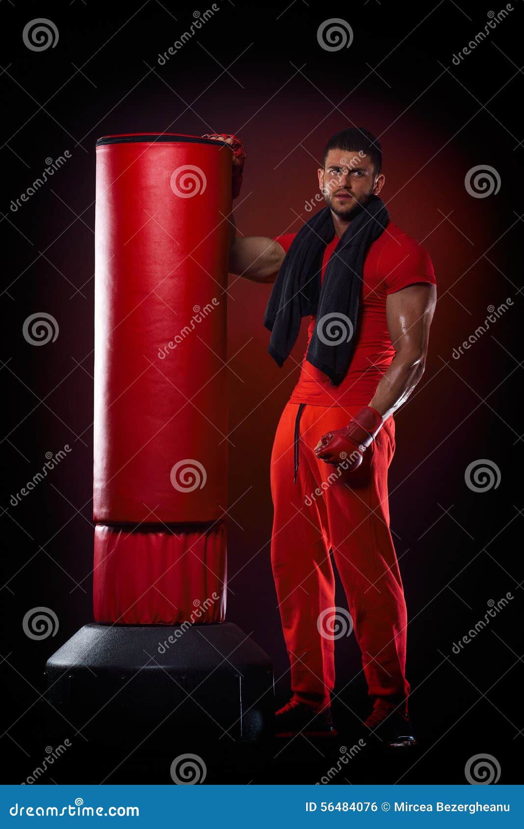 Young Man Standing by Boxing Bag Stock Photo - Image of athletic ...
