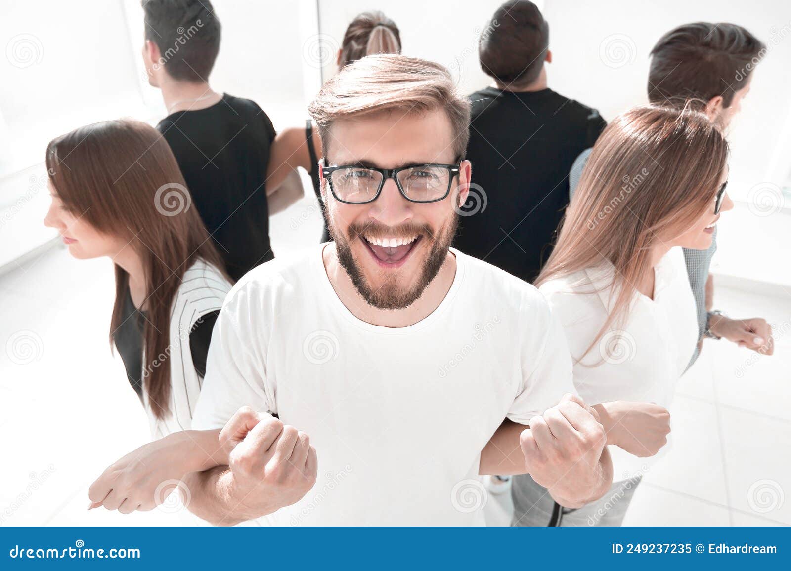 Young Man Standing in a Circle with a Business Team Stock Image - Image ...