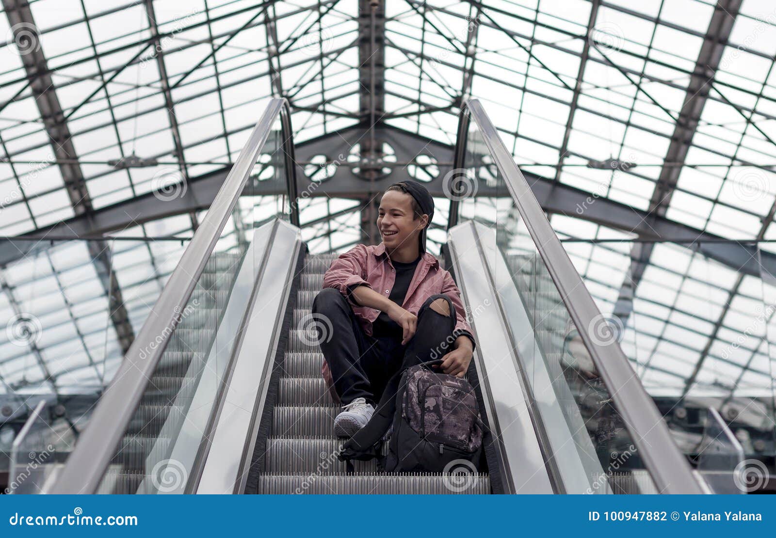 Young Man Standing on the Escalator Rises Stock Photo - Image of relax ...