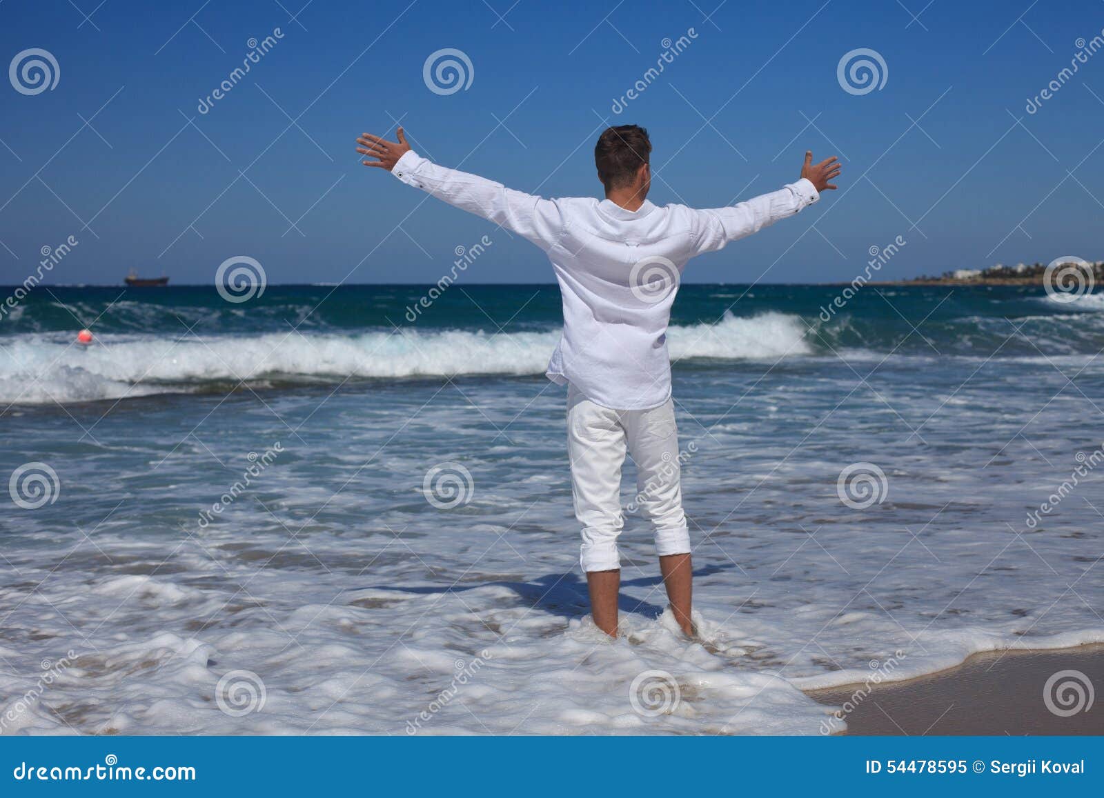 A Young Man Standing Hands Outstretched at the Seashore Stock Image ...