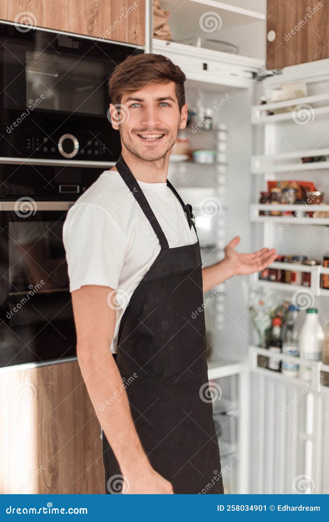 Young Man Standing in His Cozy Kitchen Stock Image - Image of ...